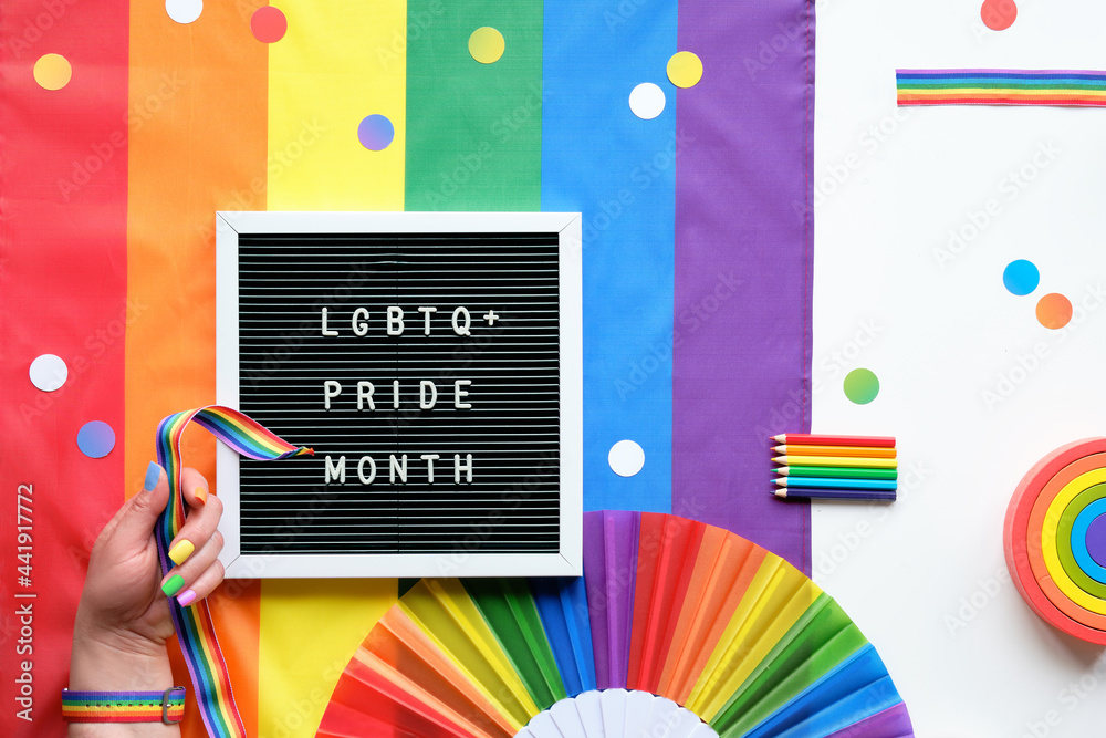 Foto de Stock Rainbow LGBT flag background with frames, fan, pencils ...