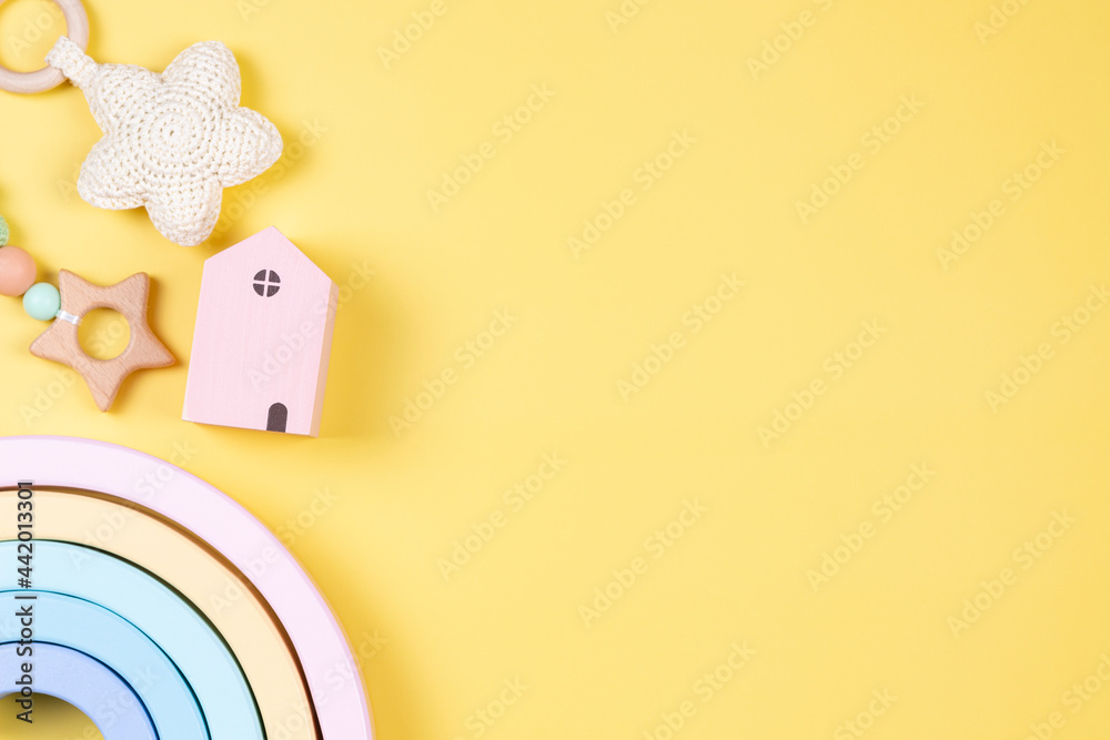 Baby kid toys on yellow background. Sustainable early childhood ...