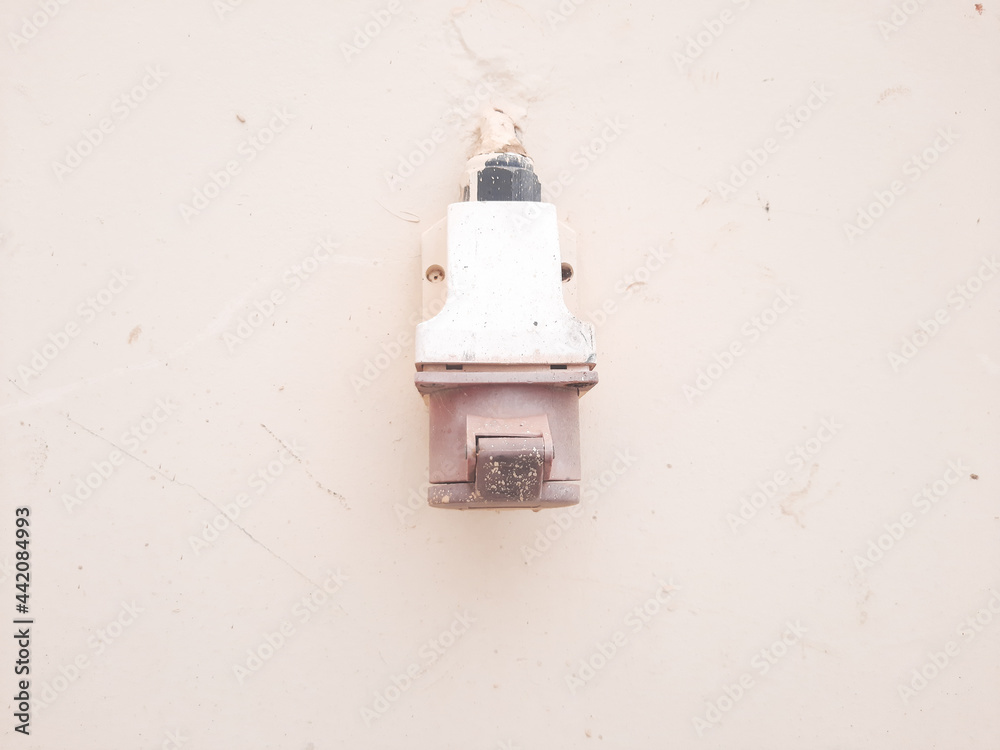 four-pin three-phase wall-mounted power socket commonly used for high ...