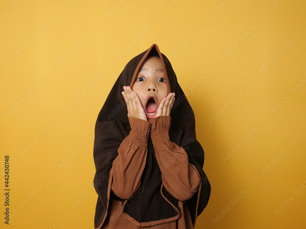 Funny cute Asian muslim little girl wearing hijab looked shocked ...