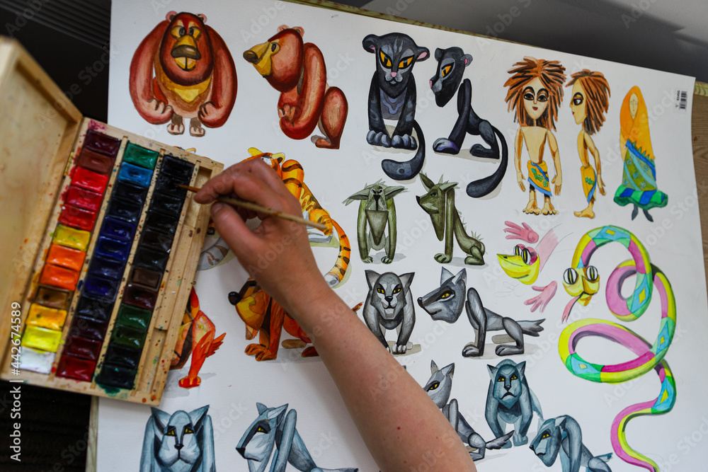 The animator draws with a pencil and draws characters from cartoons ...