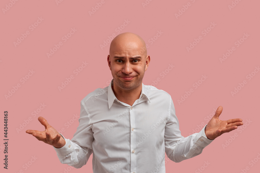 Why you do this. Horizontal shot of bald guy with bristle. With puzzled ...