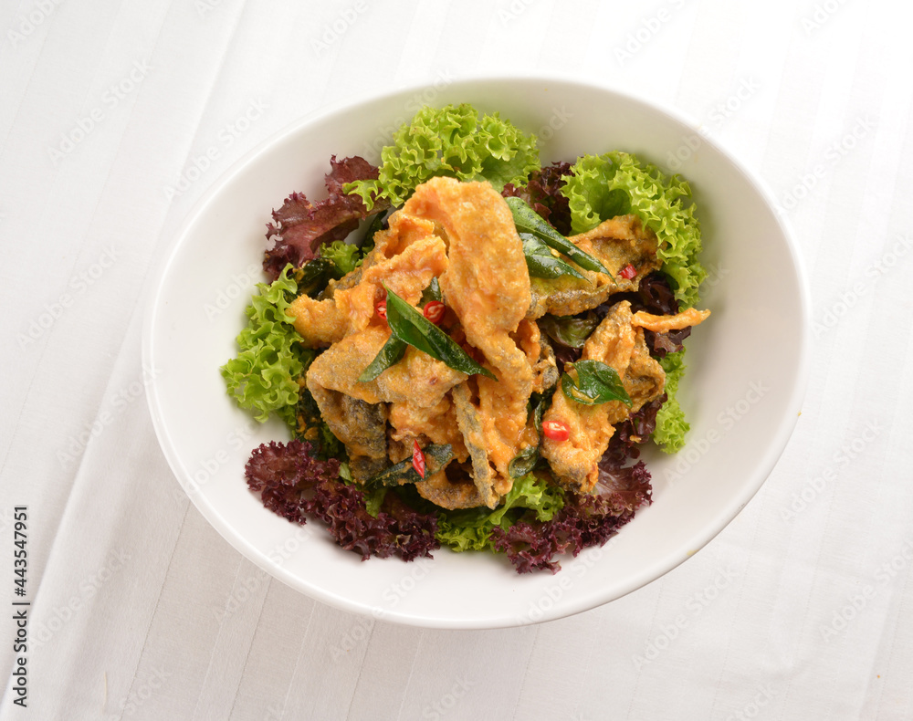 popular deep fried crispy salmon fish skin with salted egg yolk paste ...