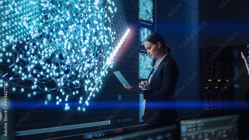 Young Female Computer Science Engineer Working on Laptop next at Big ...