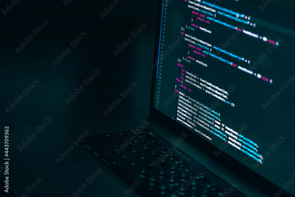 The code on the laptop screen at night. The concept of the SWIFT ...