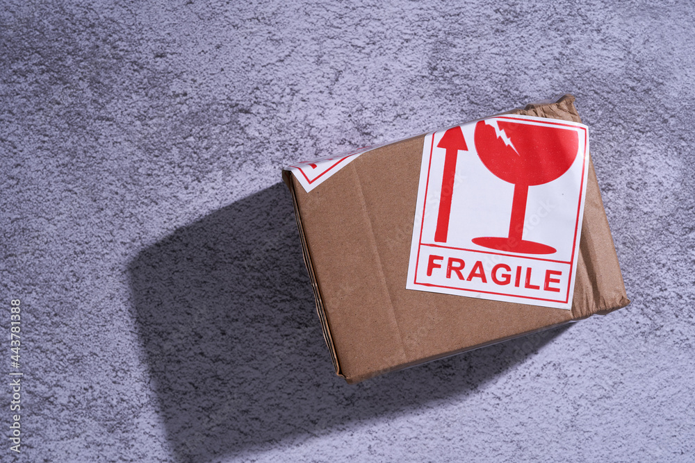 top view of parcel with fragile sticker Stock Photo | Adobe Stock