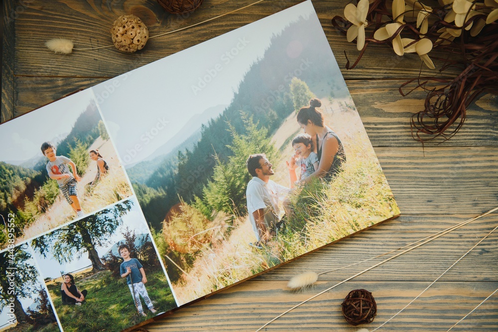 Luxury wooden photo book on natural background. Family memories ...