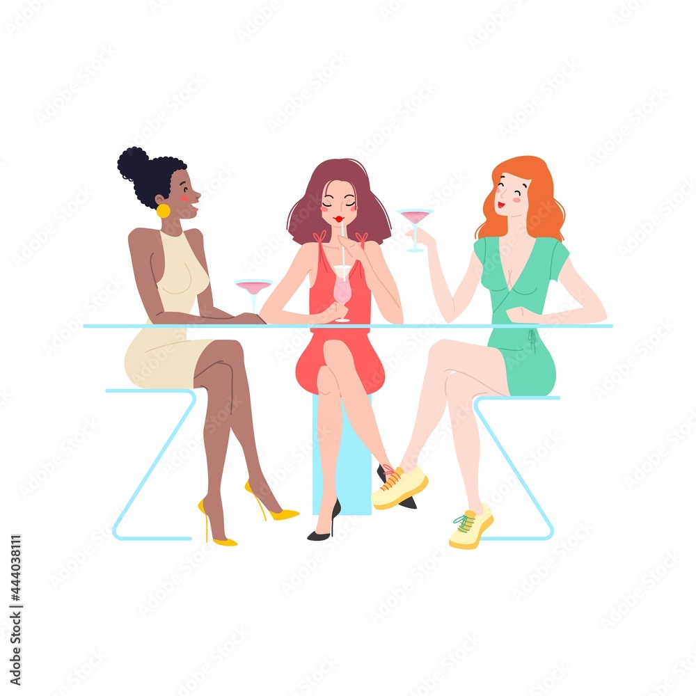 Three multiracial girlfriends enjoying cocktails in a restaurant or bar ...