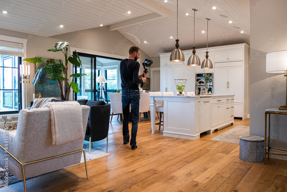 Photographer filming a house for real estate video. Stock Photo | Adobe ...