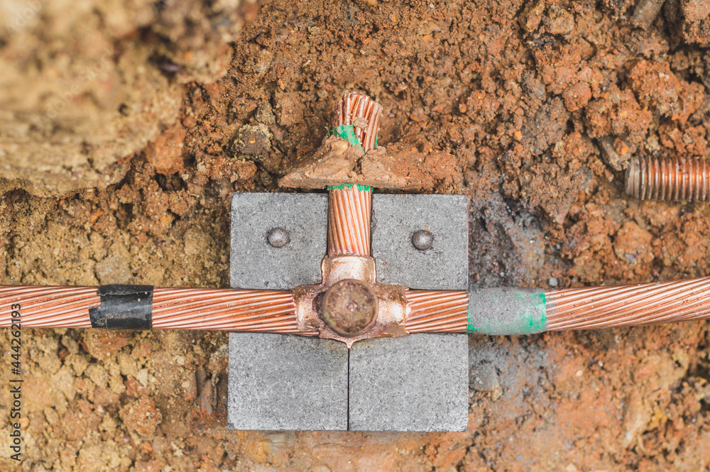 Welding copper ground wire on ground rod.Welding copper ground wire ...