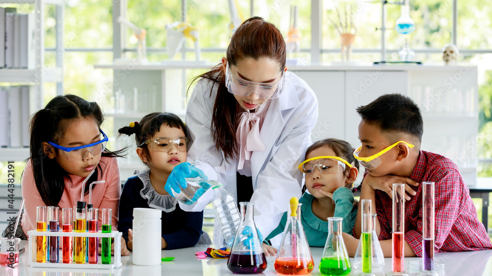 Asian female professional scientist teacher in white lab coat rubber ...