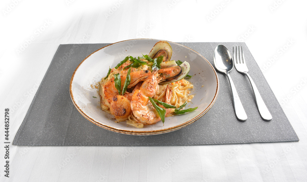 mixed seafood pasta with big tiger prawn, scallop shell clam and muscle ...