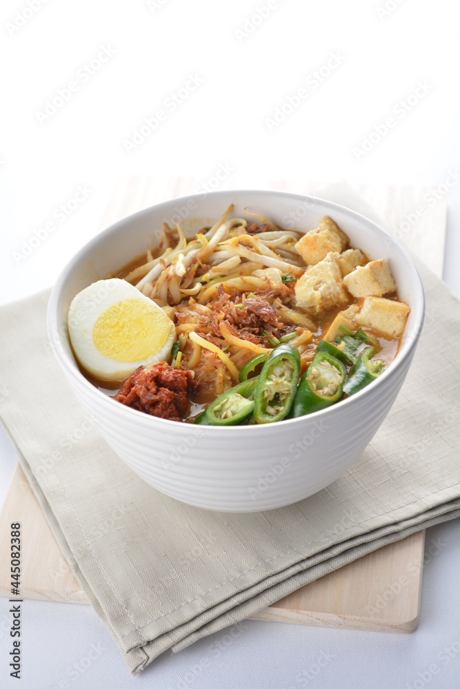 Malay mee rebus noodle with boiled egg, tofu, green chilli, sambal ...