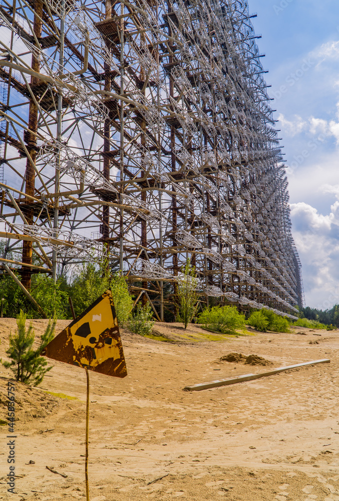 Radioactive sign next to the abandoned Soviet Duga over the horizon ...