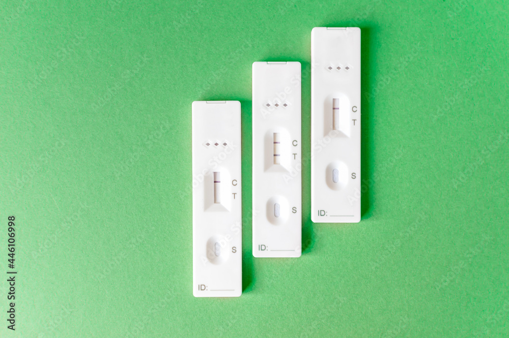 Positive and negative rapid lateral flow COVID 19 tests Stock Photo ...