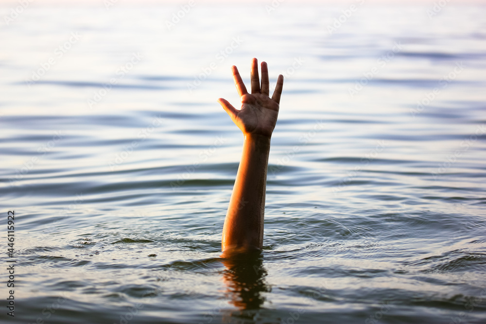 Photo Stock A man is drowning in water. A hand peeks out from under a ...