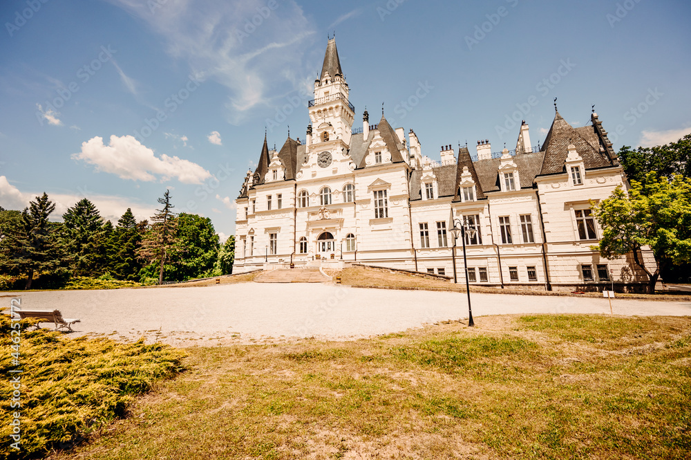 Budmerice Castle from 19th century in nature landscape. Tree in forest ...
