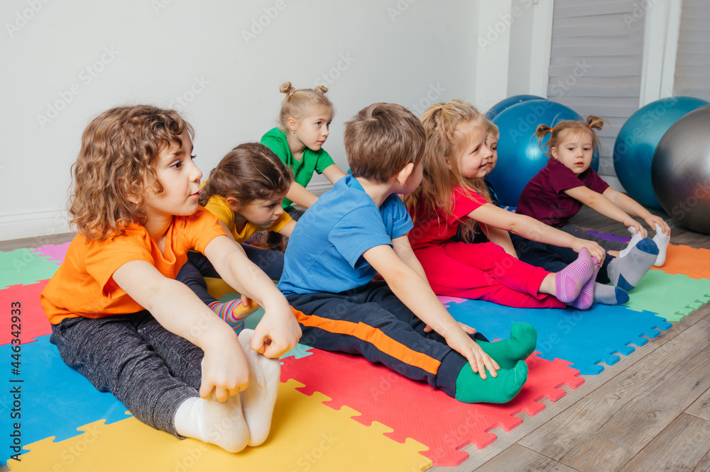 Children exercising while physical education lesson at preschool Stock ...
