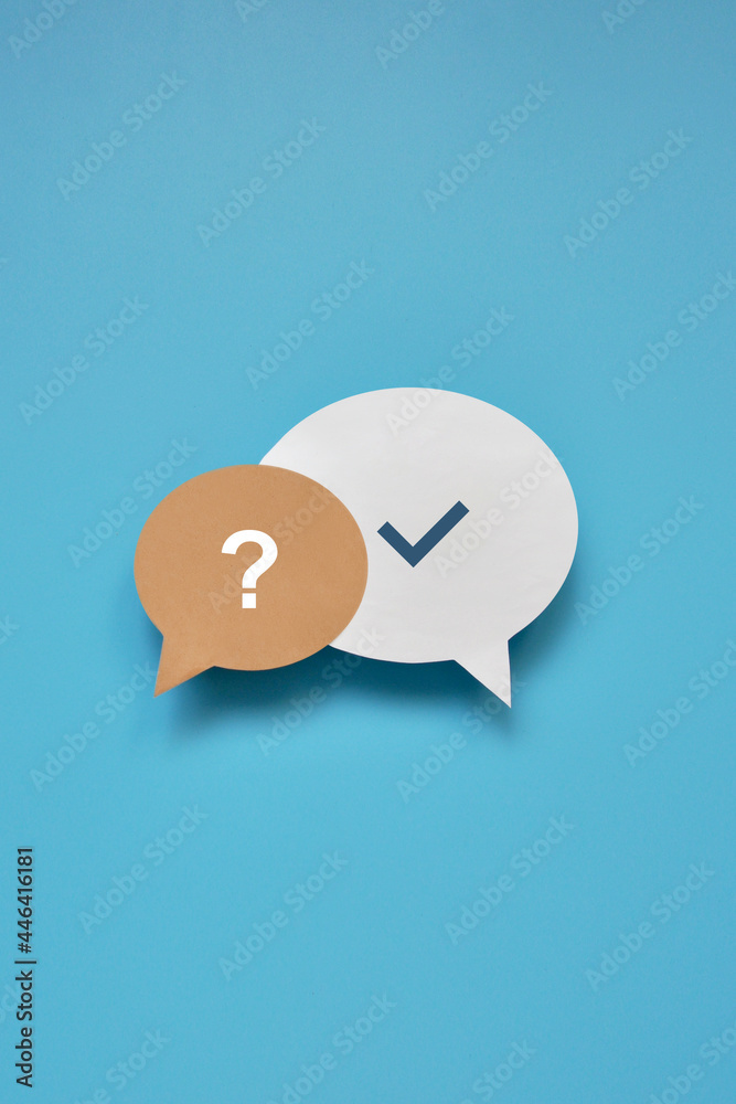 Conversational clouds with a picture of a question and a tick. A symbol ...