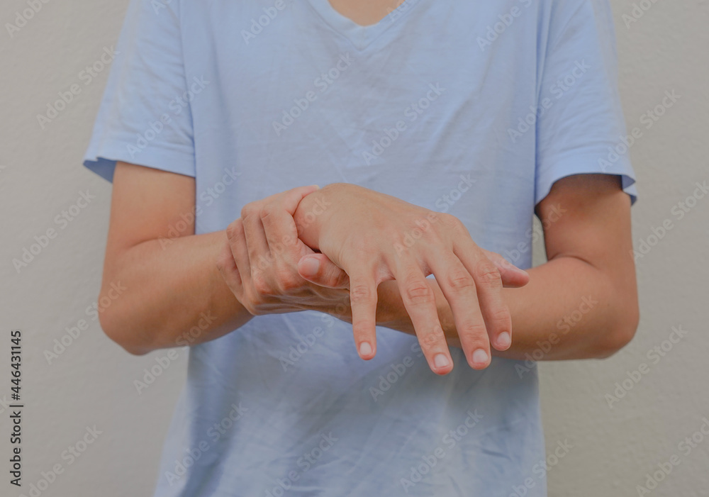 a man support his arms which pain,numbness,weakness,paralysis concept ...