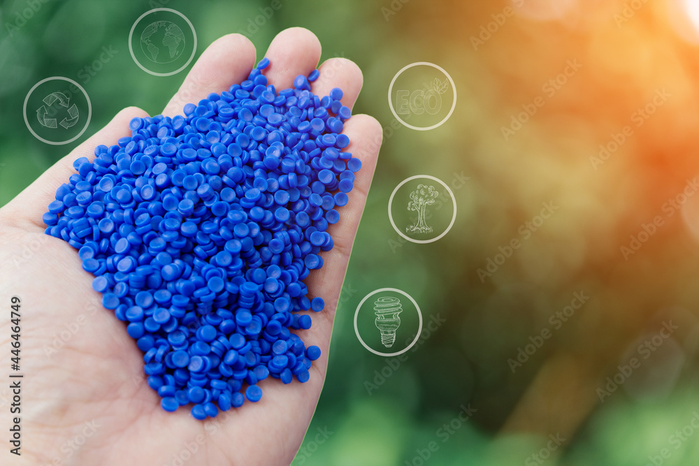 Hand holding plastic beads. recycle icon. Save environment concept ...