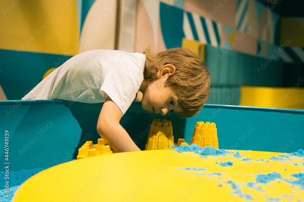 Boy spends time in children's learning game center . Development of ...