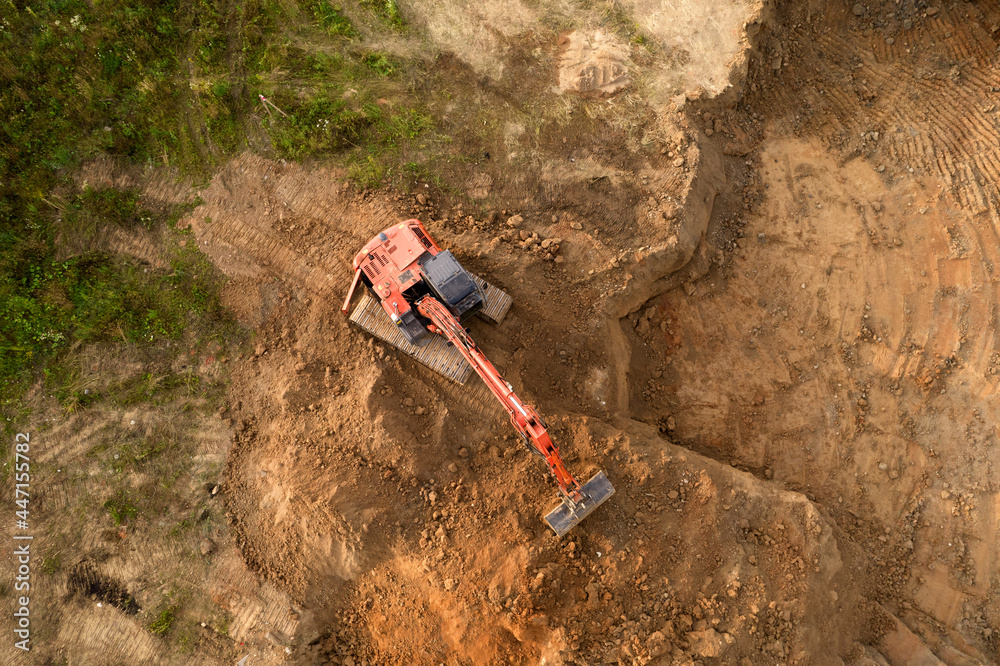 Excavator dig ground at a construction site. Trench for laying external ...