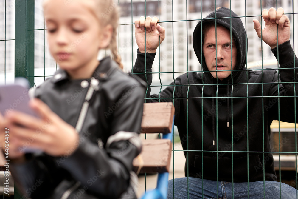 man chasing girl on playground. Victims are children of rapist ...