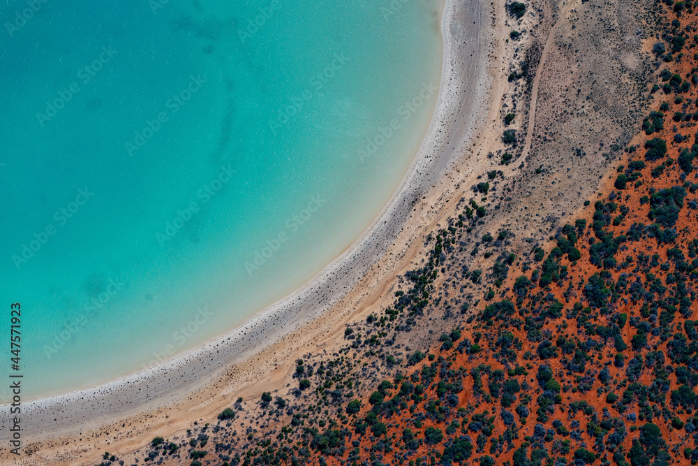 Foto de Stock Abstract aerial view of blue-green water in shifting red ...