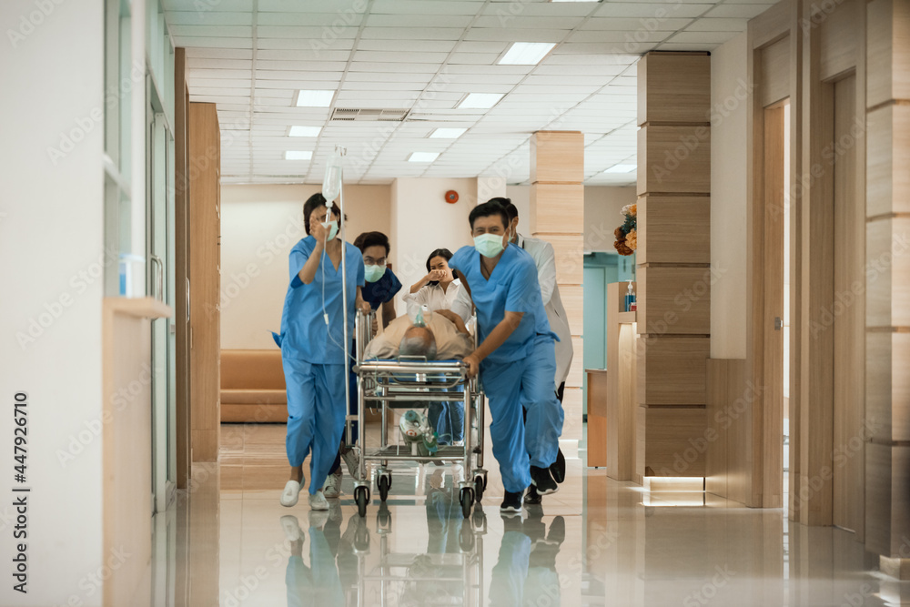 Emergency Department: Group of Doctors, Nurses, Paramedics Push Gurney ...