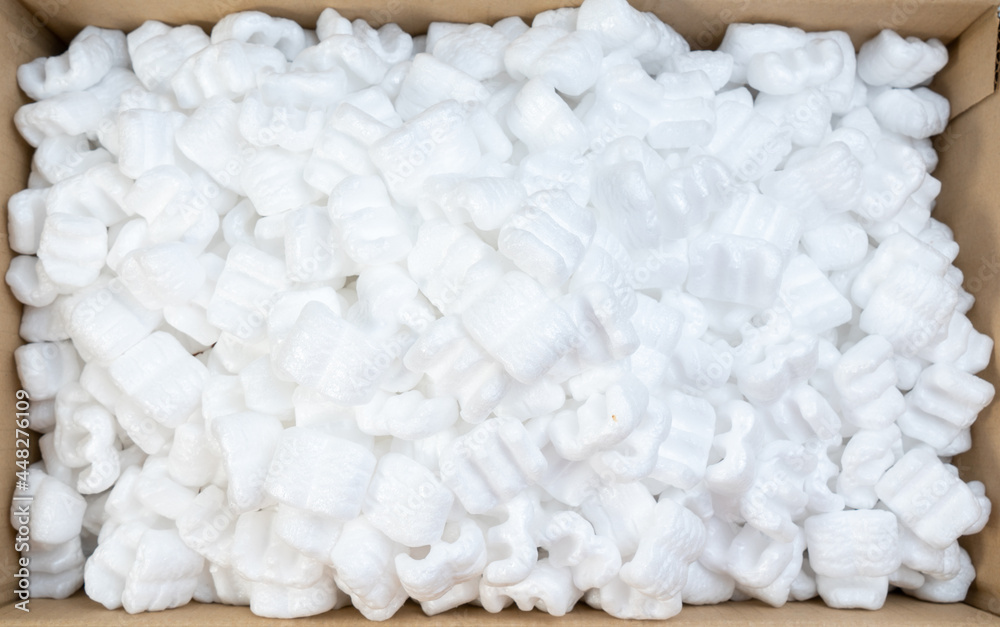 Top view of white polystyrene foam in parcel box. Polystyrene foam ...