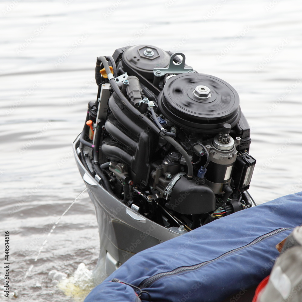 Start an outboard boat motor without the hood cap on the transom of the ...