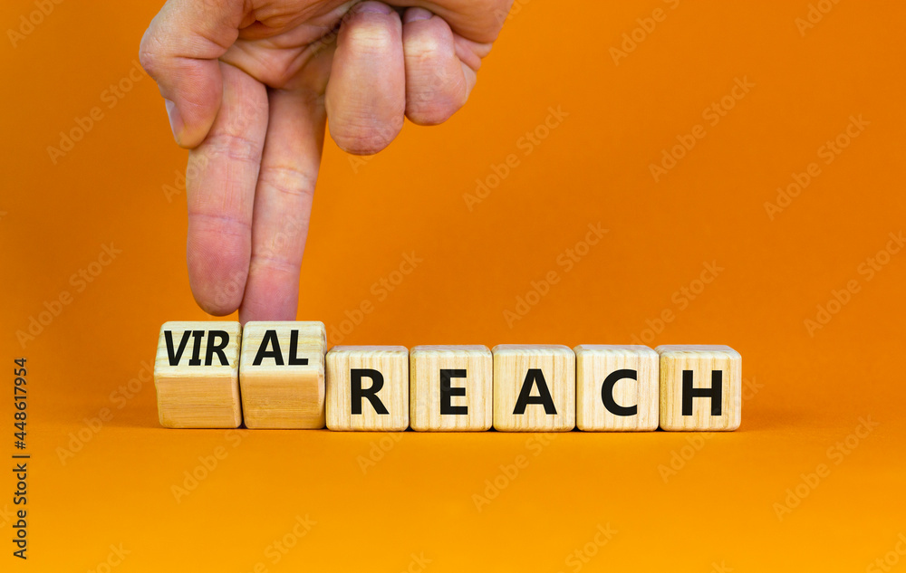 Viral reach symbol. Businessman turns wooden cubes and changes words ...