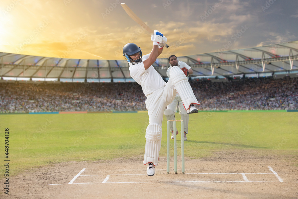 Cricketer batsman hitting a shot Stock Photo | Adobe Stock