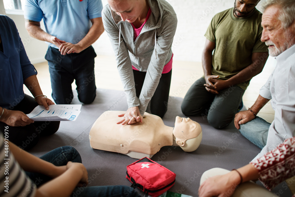 Group of diverse people in cpr training class Stock Photo | Adobe Stock