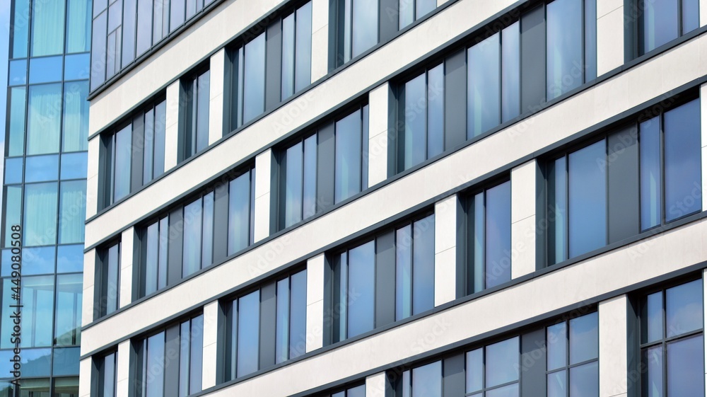 Futuristic facade of a modern office building clad in glass. Glass ...