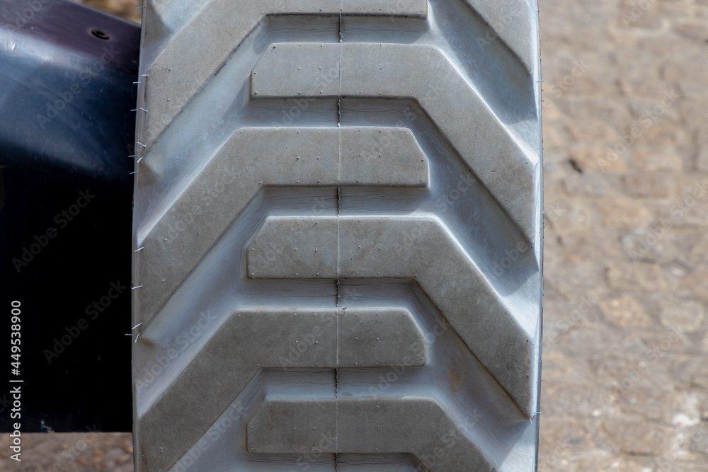 Selective focus of truck mounted crane tires texture, Close up big grey ...
