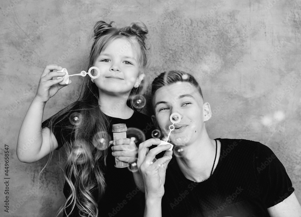 caucasian siblings - teenager boy brother and little girl sister with ...