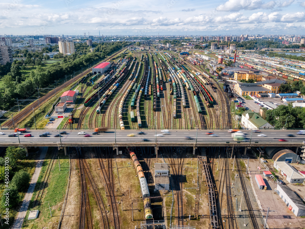 Aerial photo of railway terminal. Freight wagons with goods on railroad ...