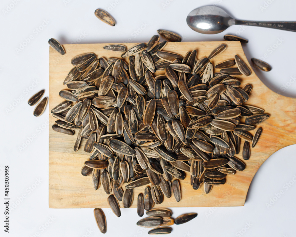 Kuaci made of sun seeds isolated on bright background. How to process ...