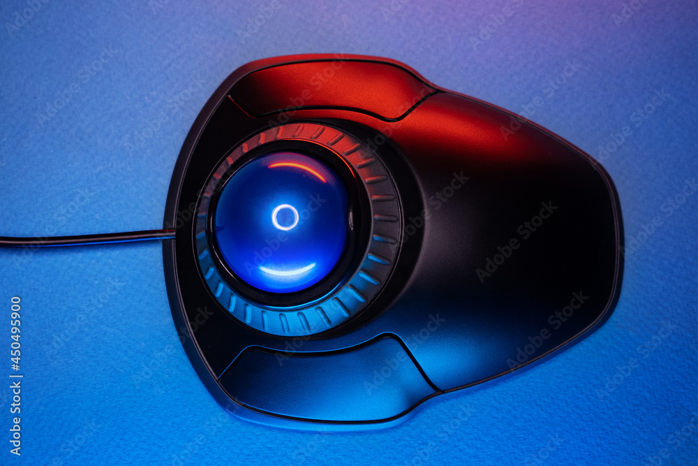 Trackball Computer Mouse on a blue background. Control Device with ...