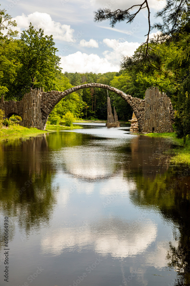 Rakotzbrucke bridge in Germany reflecting in the water Stock Photo ...