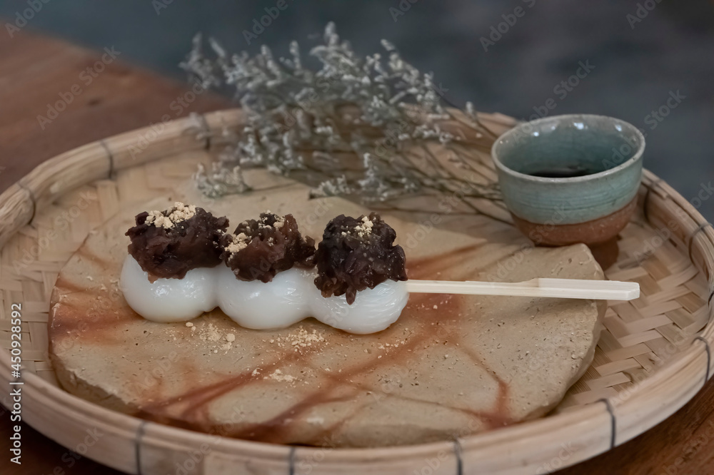 Dango small round Mochi balls skewed on bamboo sticks put in natural ...