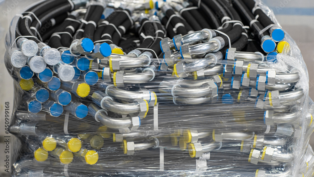 New high pressure hydraulic hose bundles are neatly folded and wrapped ...
