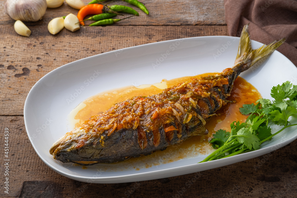 Fried fish with sweet chili sauce.Deep Fried Hamachi fish (Black-banded ...