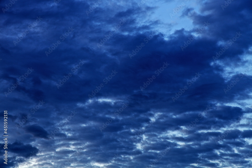 Heavy dark blue colorful dramatic stormy clouds on the sky at summer ...
