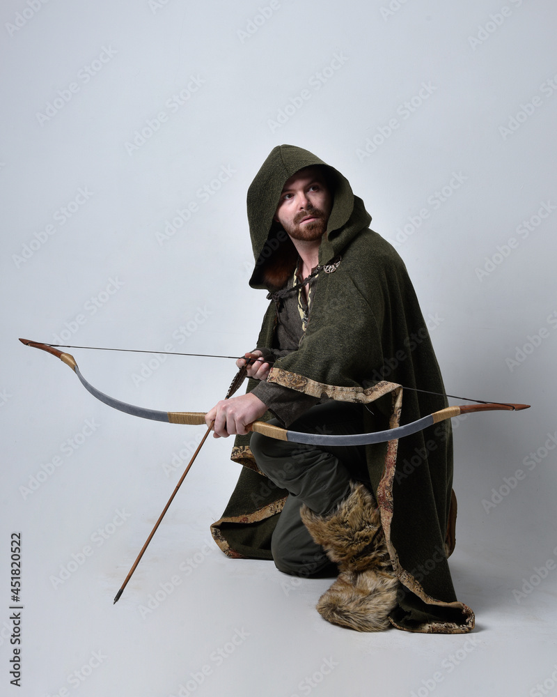 Full length portrait of young handsome man wearing medieval Celtic ...