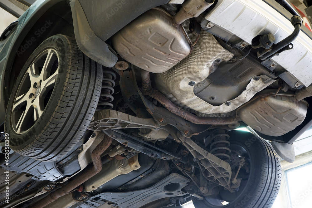 Bottom view of a modern car. The structure and elements of the rear ...
