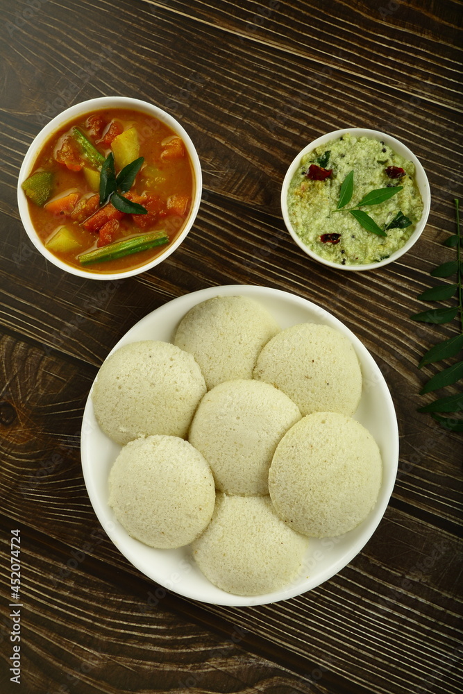 Indian vegetarian diet foods- homemade rice idly, idli iddly served ...