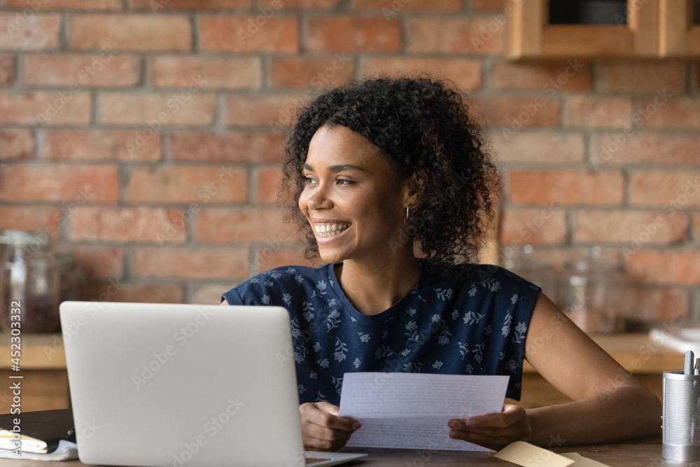 Happy millennial Black student girl receiving paper letter, invitation ...